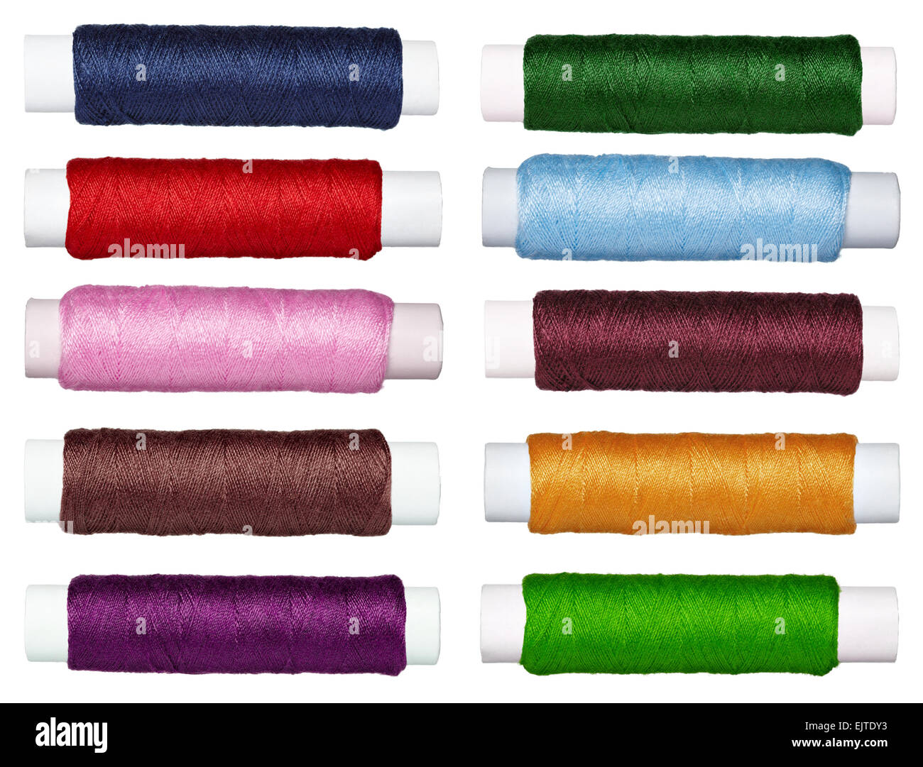 collection of various sewing threads on on white background. each one ...