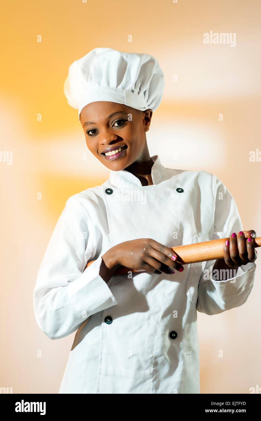 Young female cook rolling hi-res stock photography and images - Alamy