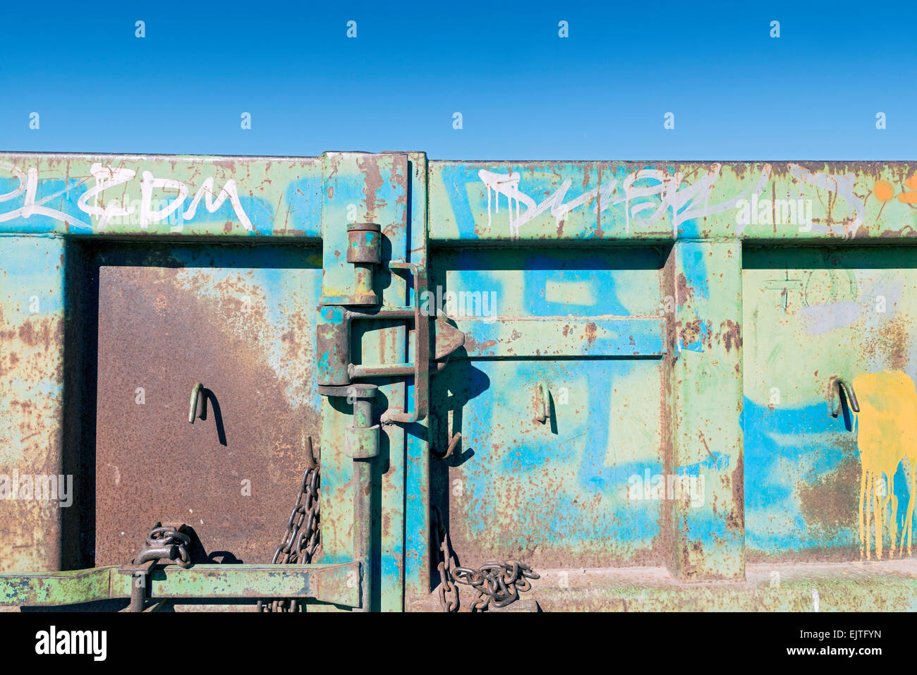 Rusty, corroded old metal door with latch, chain and bolts Stock Photo ...