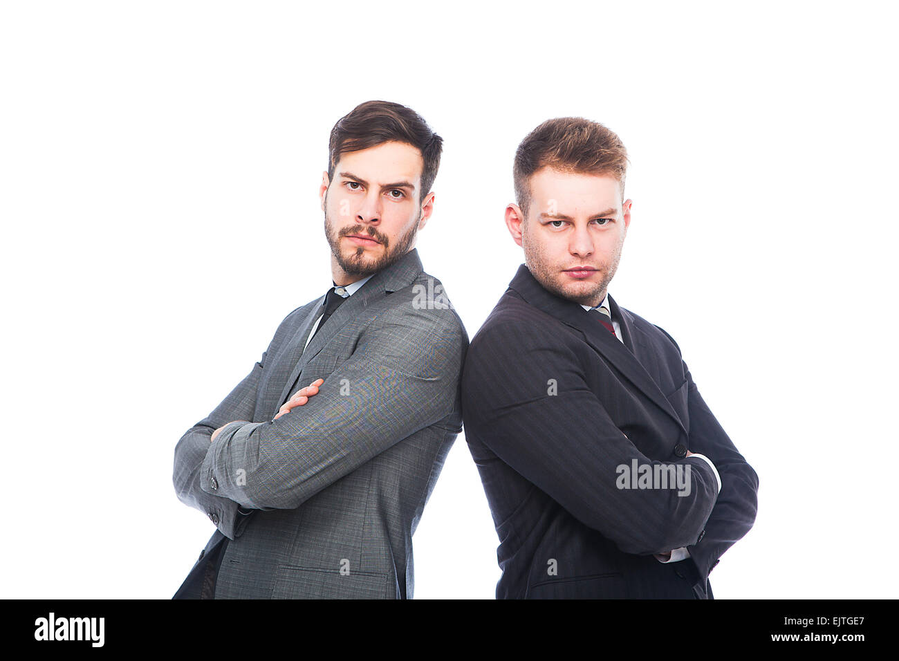 businessmen back to back beeing very serious on white background Stock ...