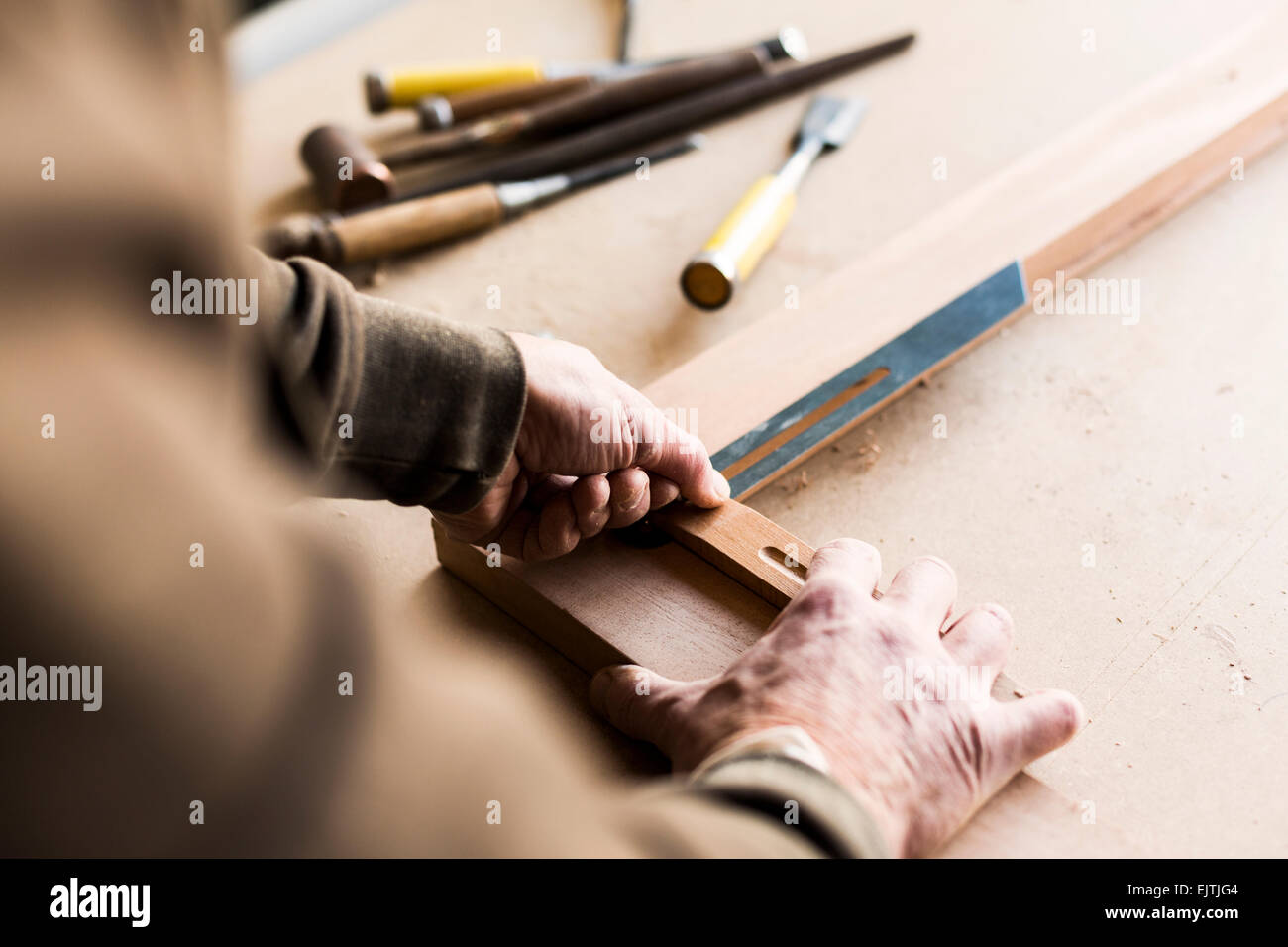 Cropped image of carpenter using sliding T bevel in workshop Stock ...