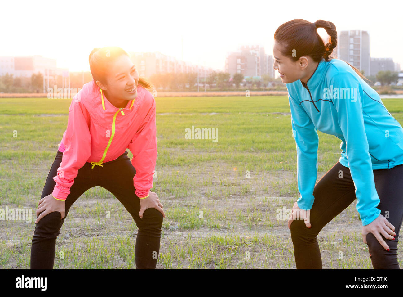 Young women resting during exercise Stock Photo - Alamy