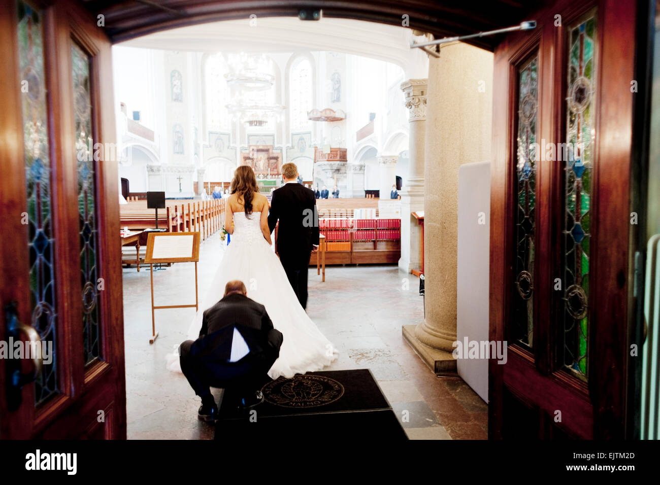 Bride entering church hi-res stock photography and images - Alamy