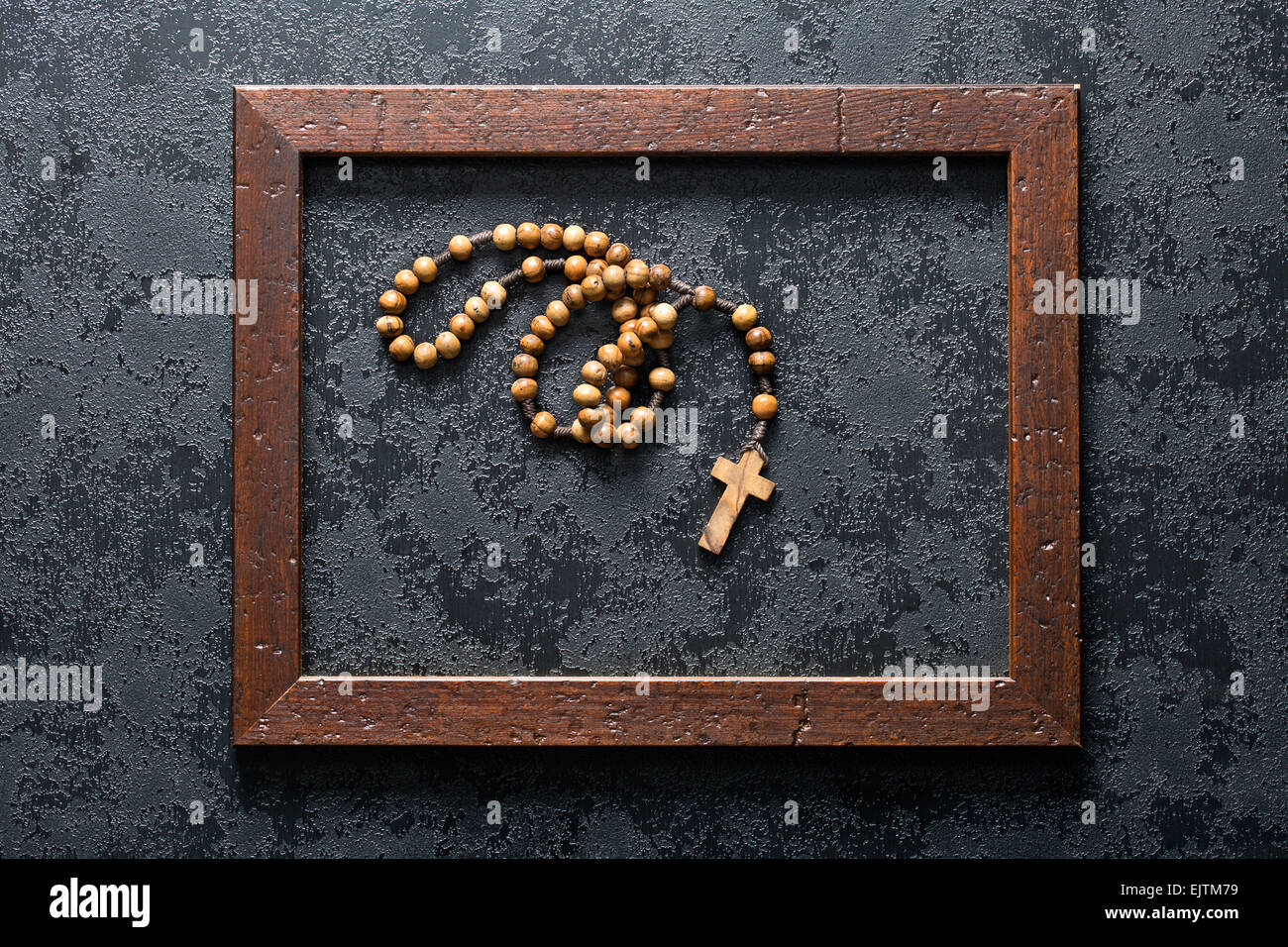 the rosary beads in wooden frame Stock Photo - Alamy