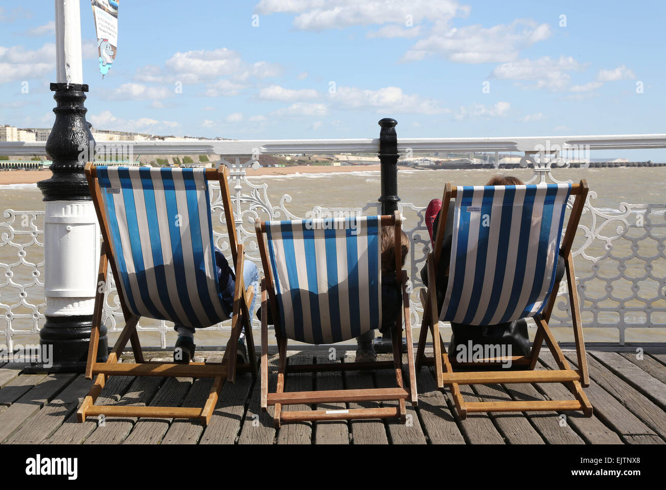 Lazy days on Brighton Pier in the Spring Sunshine Stock Photo - Alamy