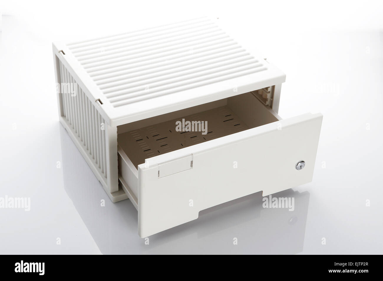 open drawer with a key , shot on a white background Stock Photo - Alamy