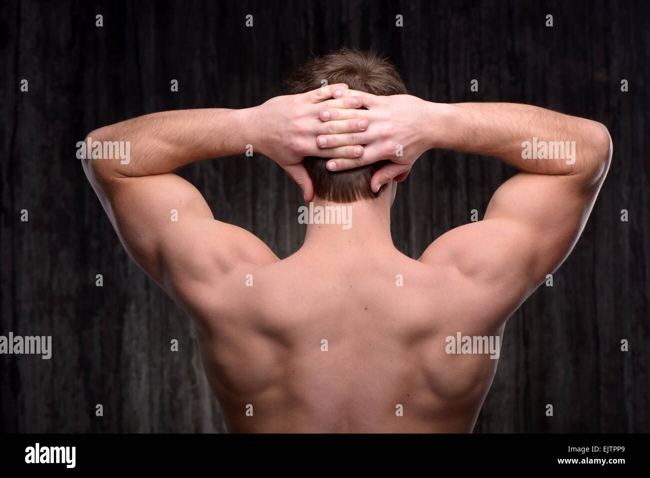 Close up of sporty man demonstrating back muscles Stock Photo - Alamy
