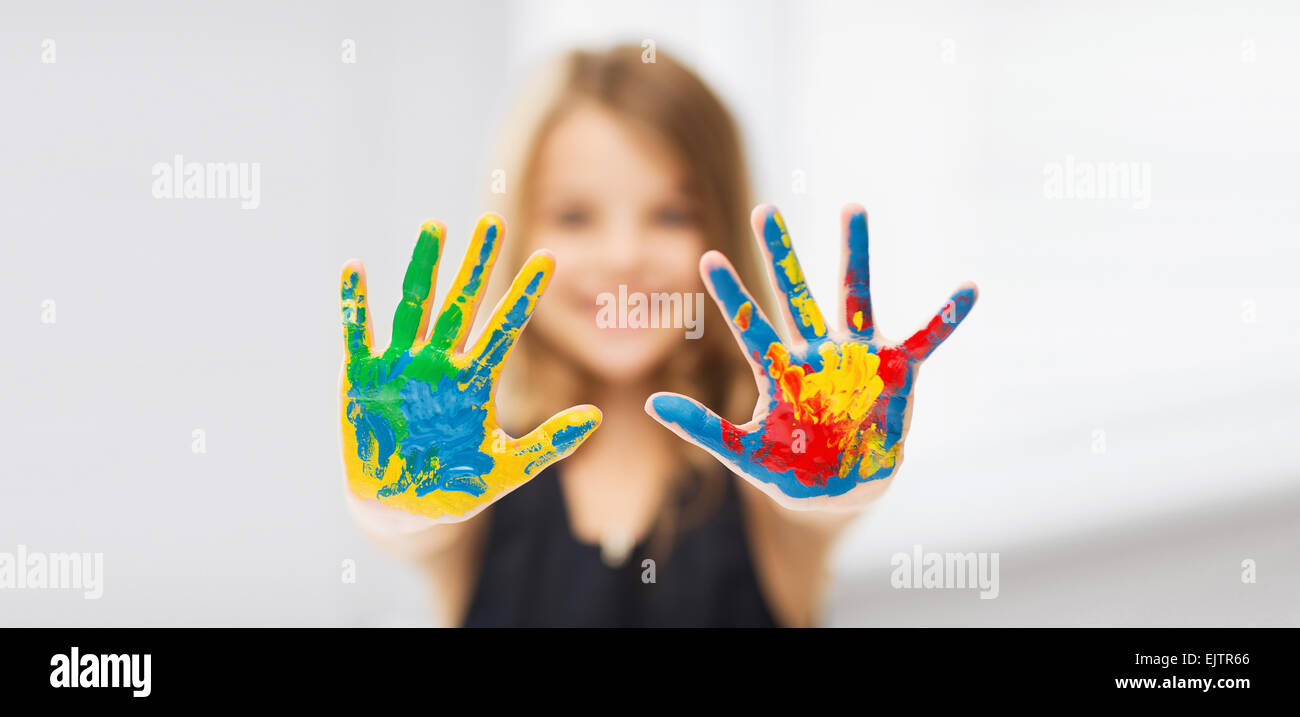 girl showing painted hands Stock Photo - Alamy
