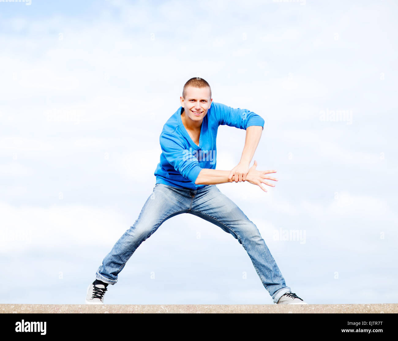 handsome boy making dance move Stock Photo - Alamy