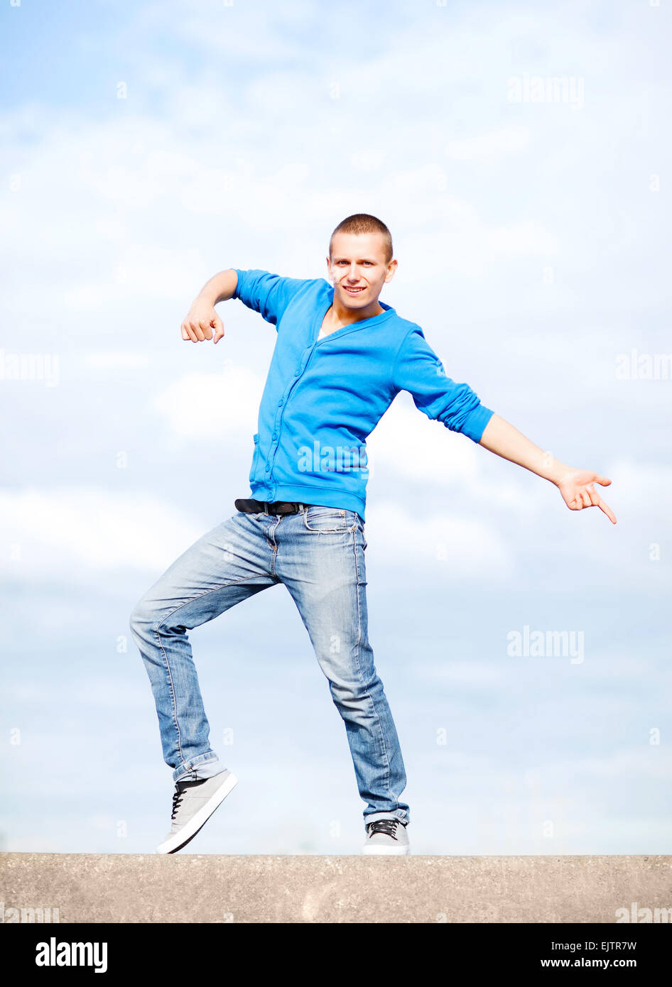 handsome boy making dance move Stock Photo - Alamy