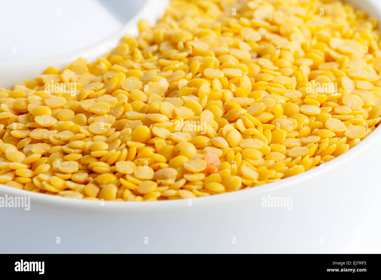 Yellow small beans in white ceramics bowl on white background Stock ...
