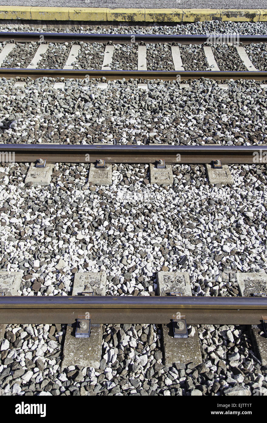 Railroad tracks at a station, a detail of train tracks, land transport ...