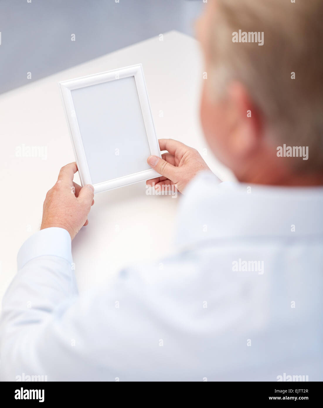 close up of old man holding blank photo frame Stock Photo - Alamy