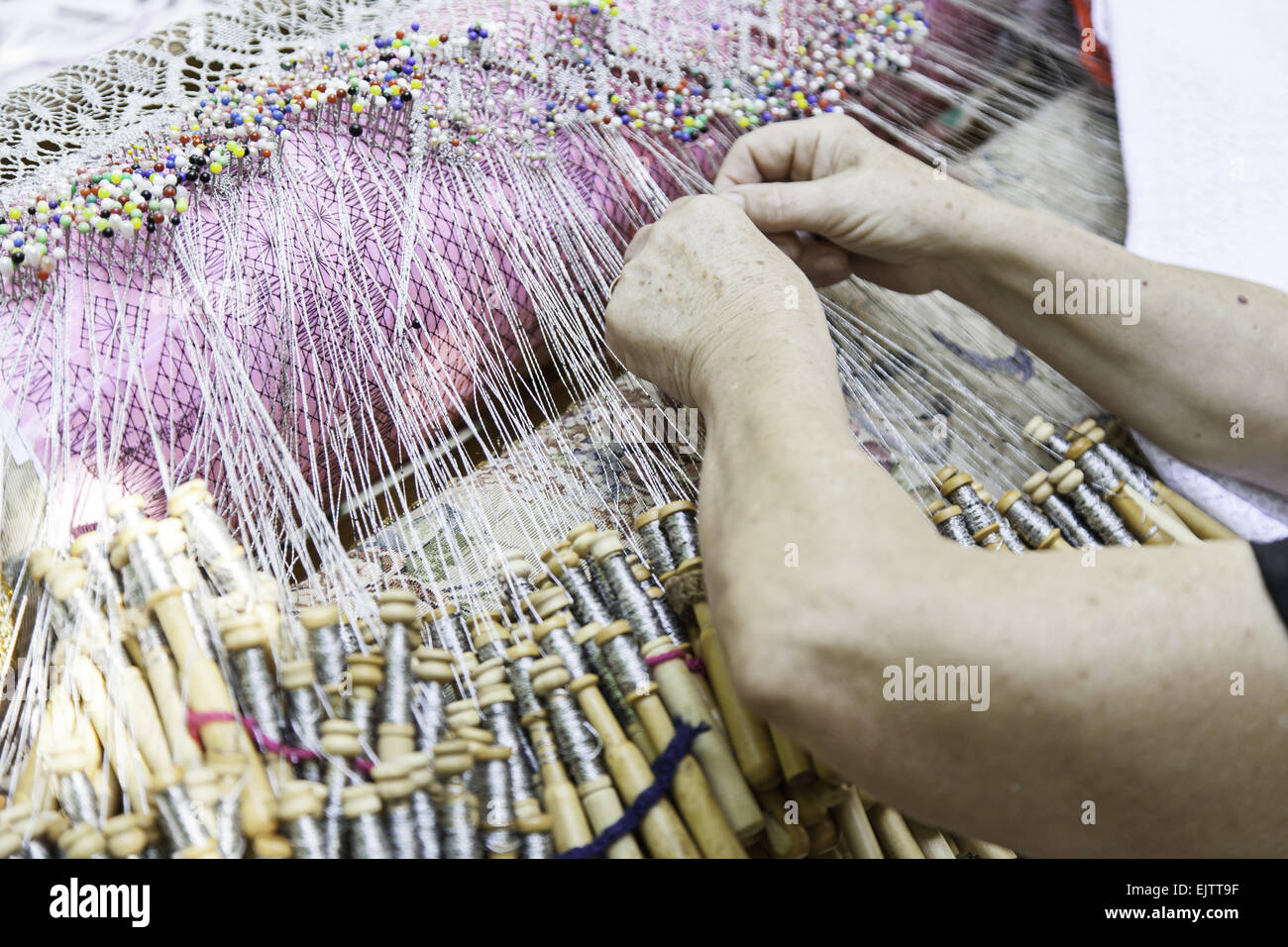 Traditional bobbin lace, detail of a women weaving, ancient tradition ...