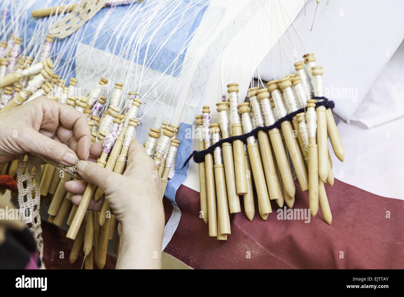 Traditional bobbin lace, detail of a women weaving, ancient tradition ...