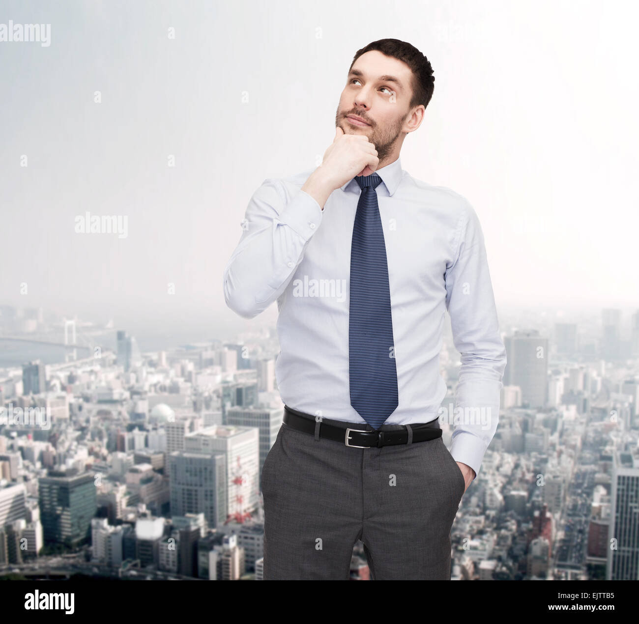 handsome businessman looking up Stock Photo - Alamy
