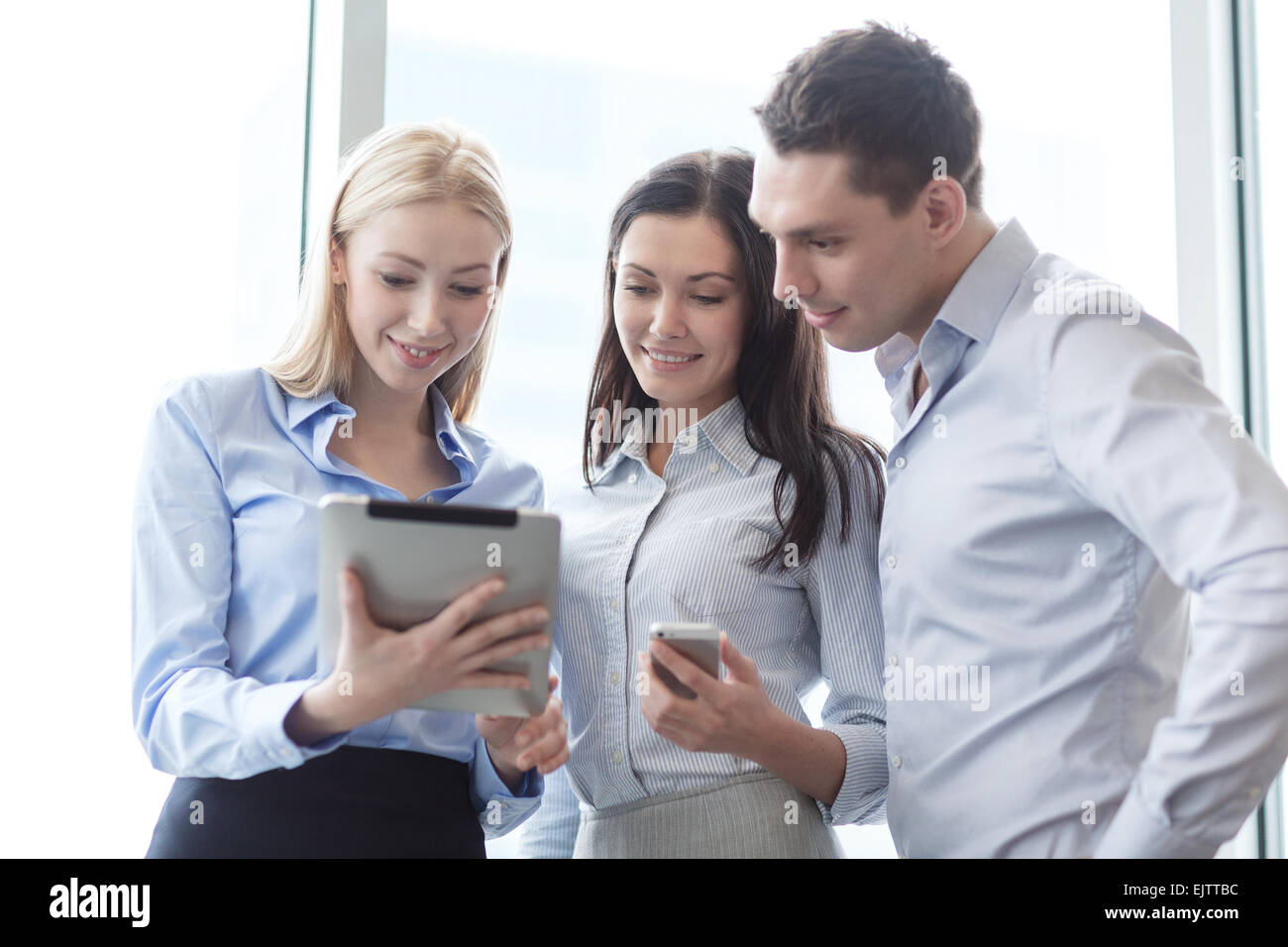 business team working with tablet pcs in office Stock Photo - Alamy