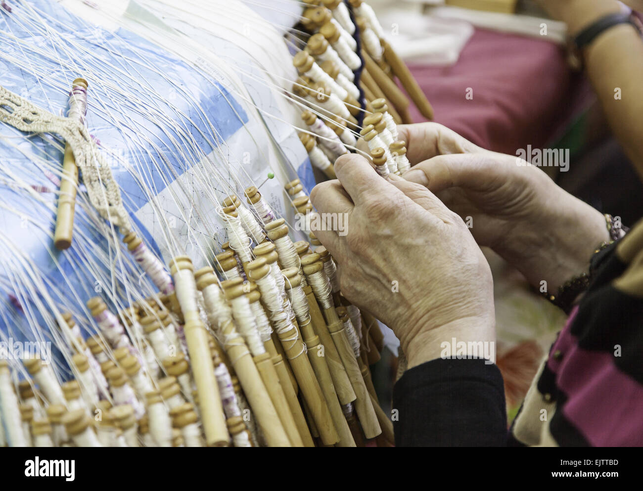 Traditional bobbin lace, detail of a women weaving, ancient tradition ...