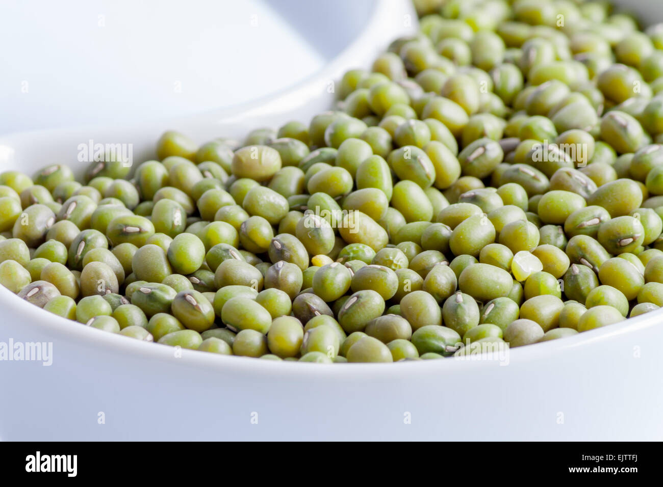 green small beans in white ceramics bowl on white background Stock ...