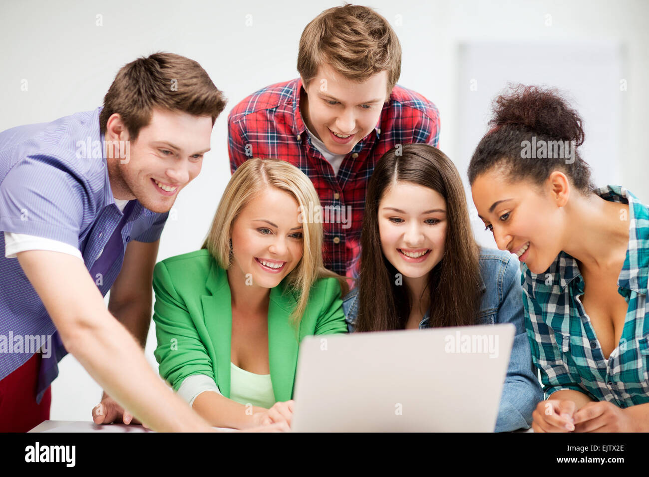 international students looking at laptop at school Stock Photo - Alamy