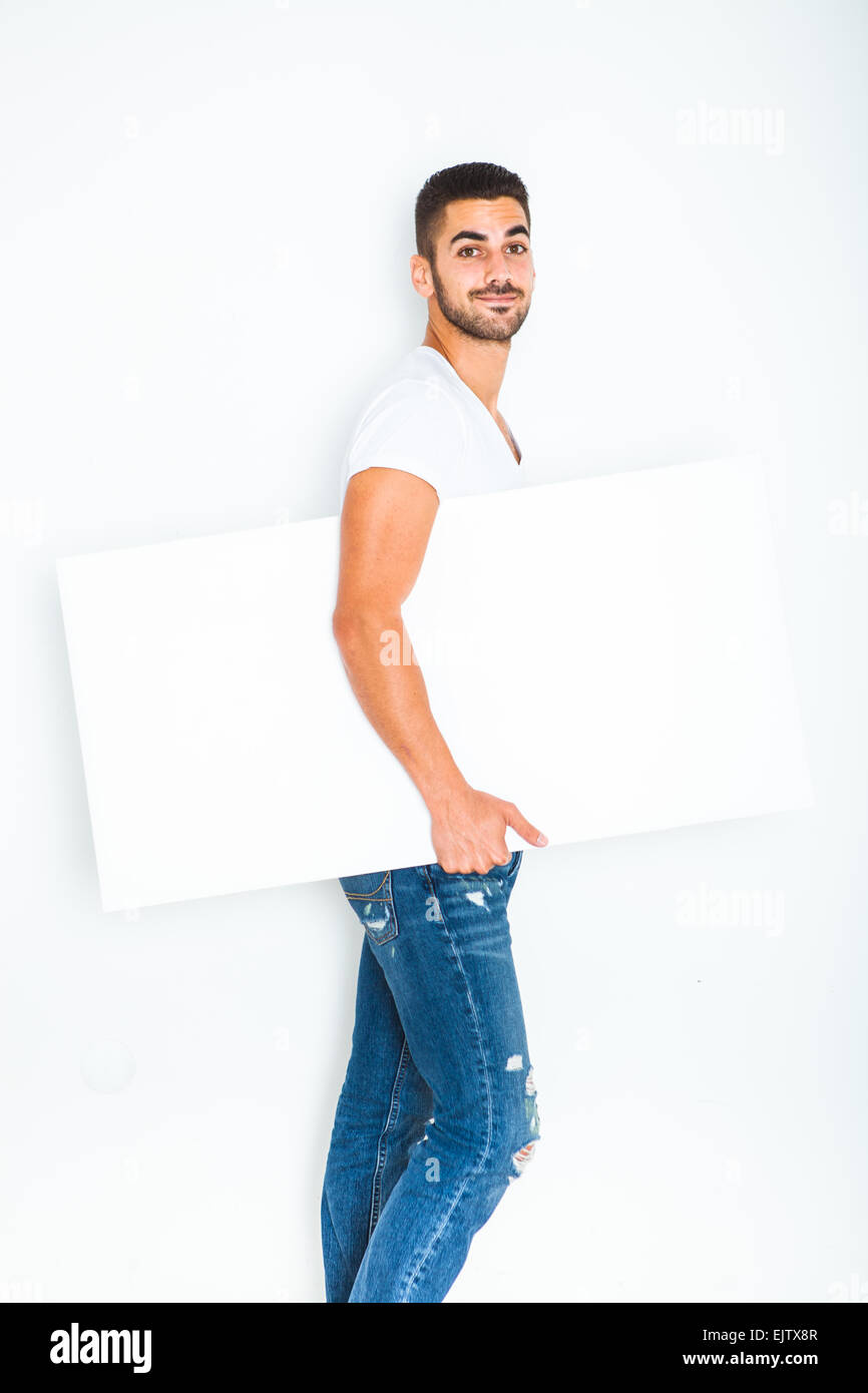 Young man showing a placard Stock Photo - Alamy