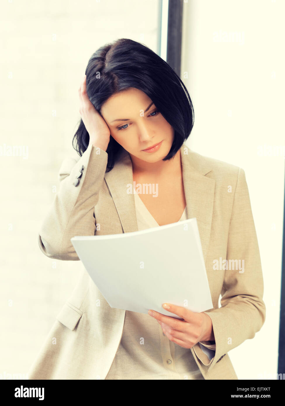 calm woman with documents Stock Photo - Alamy