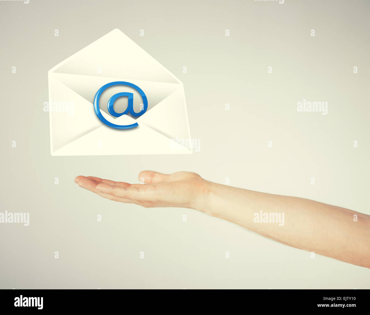 hand holding envelope with email sign Stock Photo - Alamy