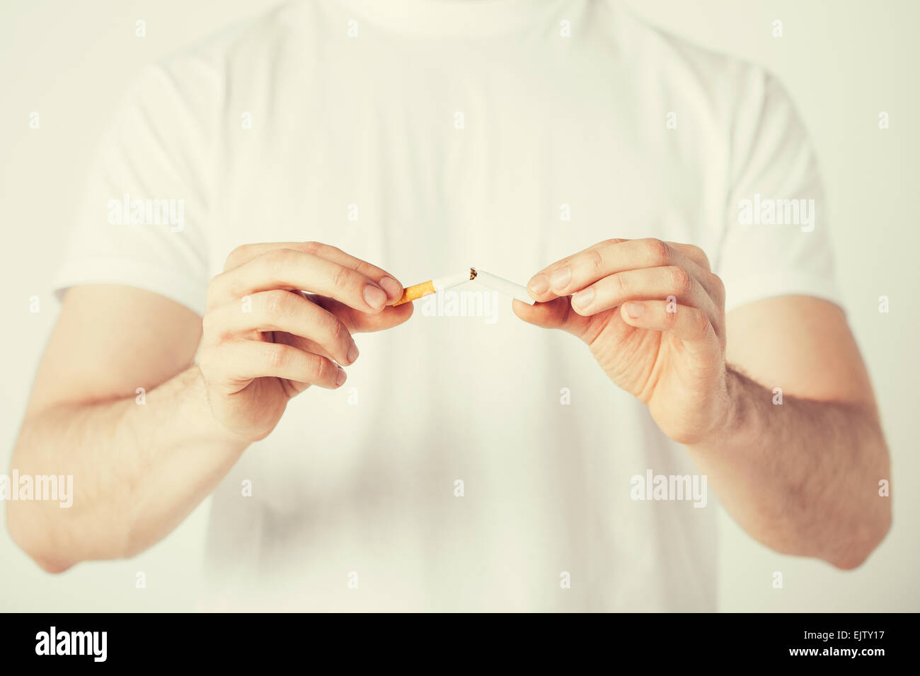 man breaking the cigarette with hands Stock Photo - Alamy