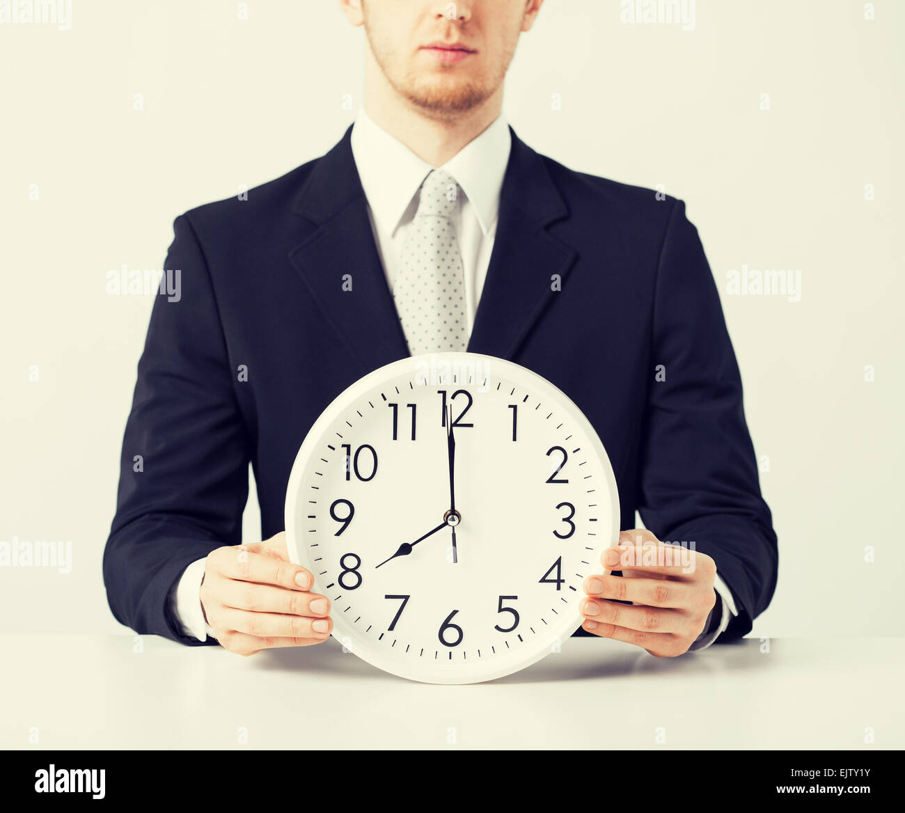 man with wall clock Stock Photo - Alamy