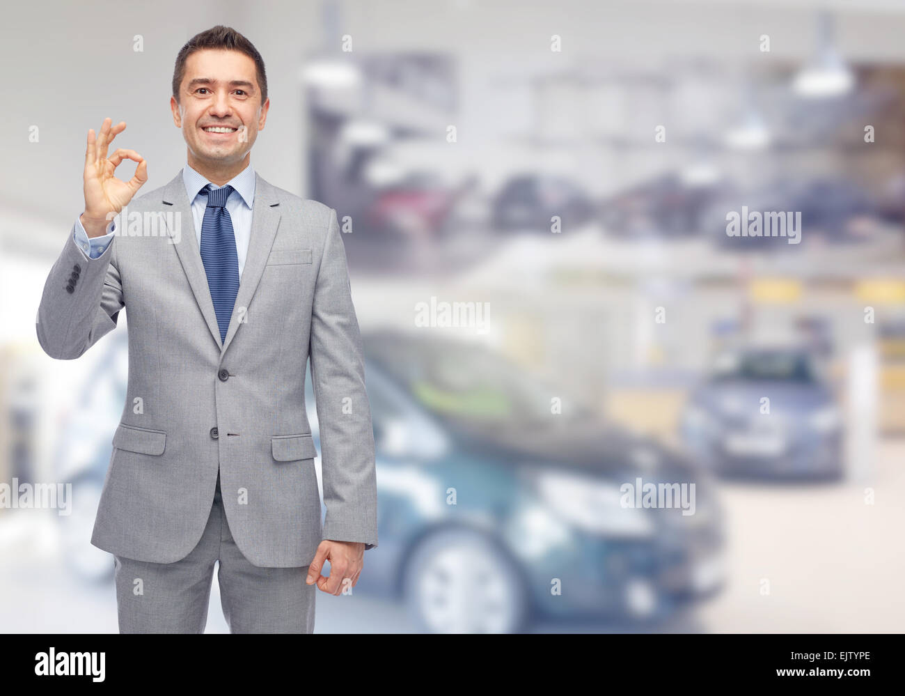 happy man at auto show or car salon Stock Photo - Alamy