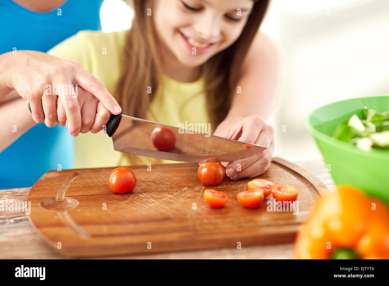 close up of happy family making dinner in kitchen Stock Photo - Alamy