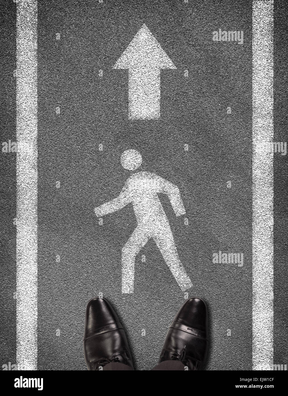 Shoes standing on asphalt road with two line and pedestrian sign Stock ...