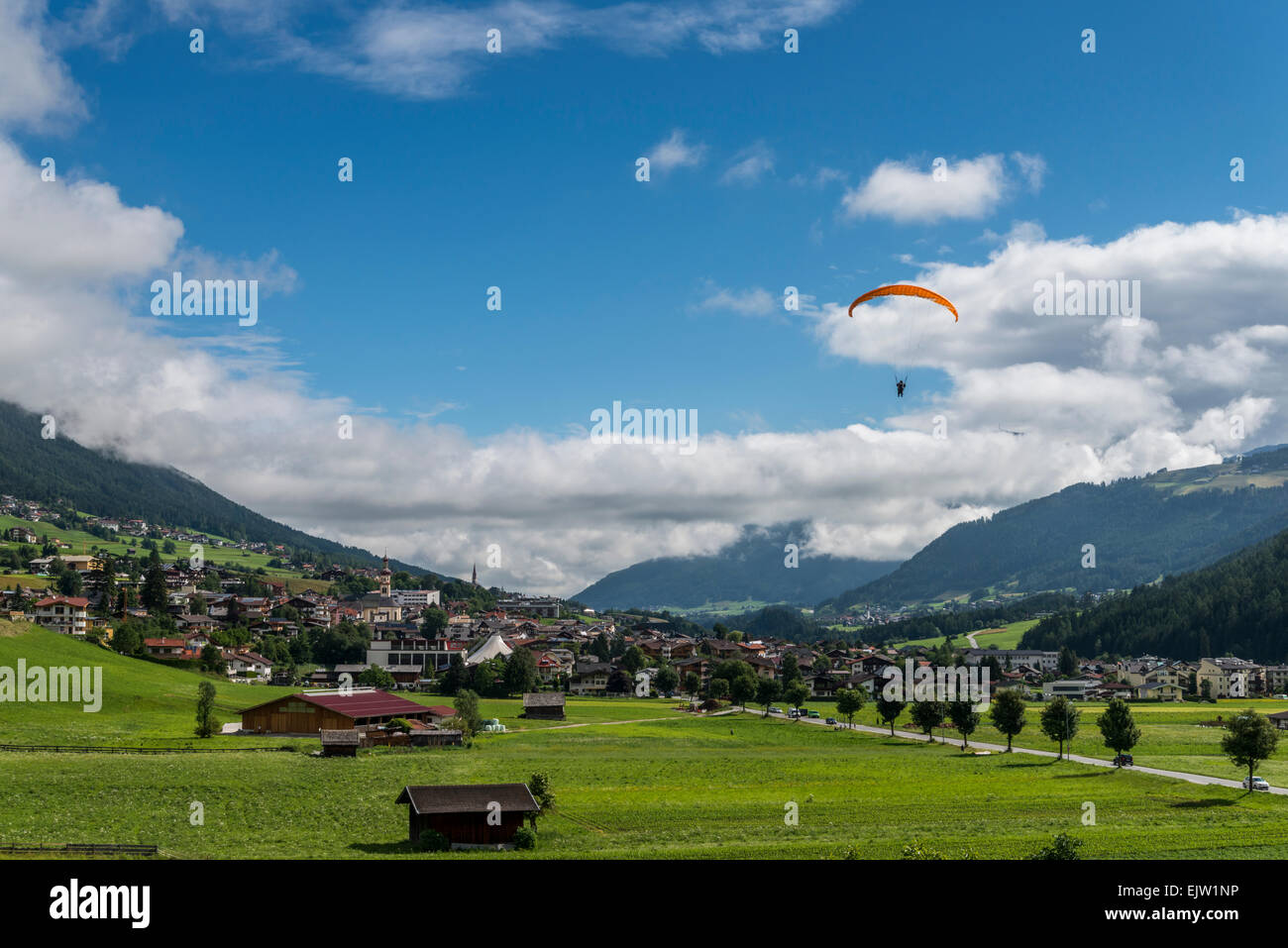 Hang glider above the meadows in the Stubaital valley Stock Photo - Alamy