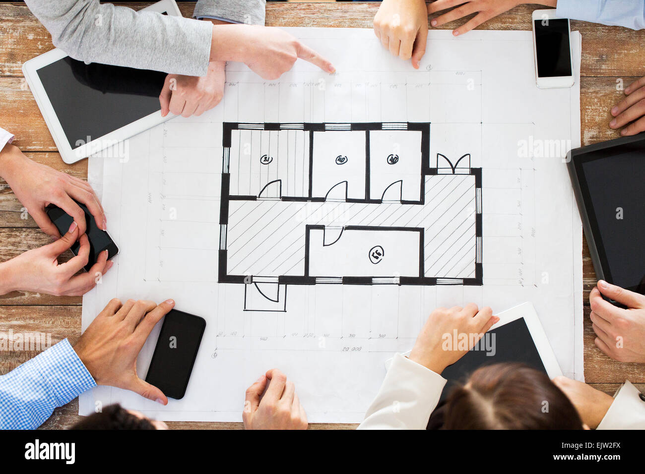 business team with blueprint and gadgets Stock Photo - Alamy