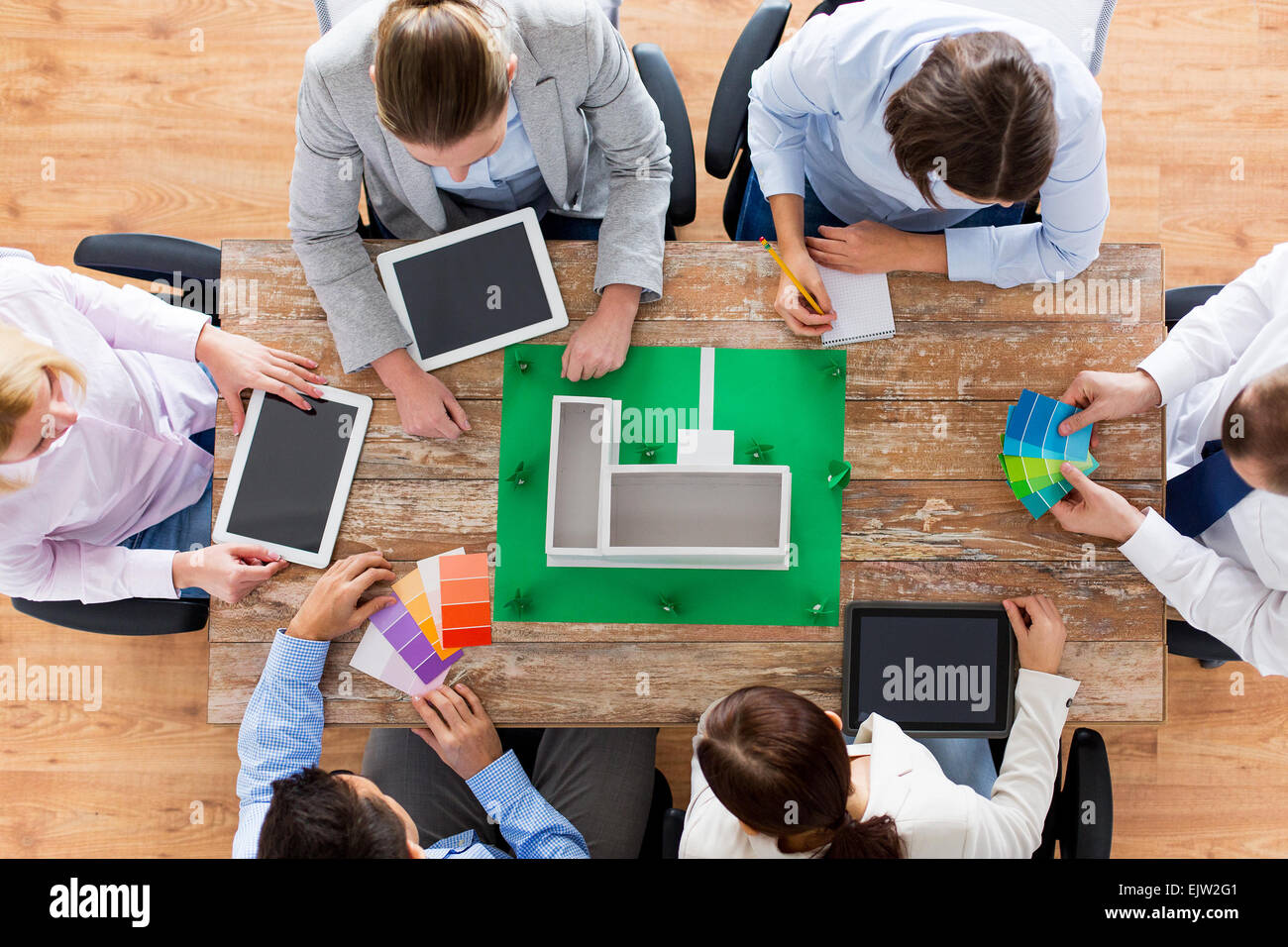 close up of business team with project layout Stock Photo - Alamy