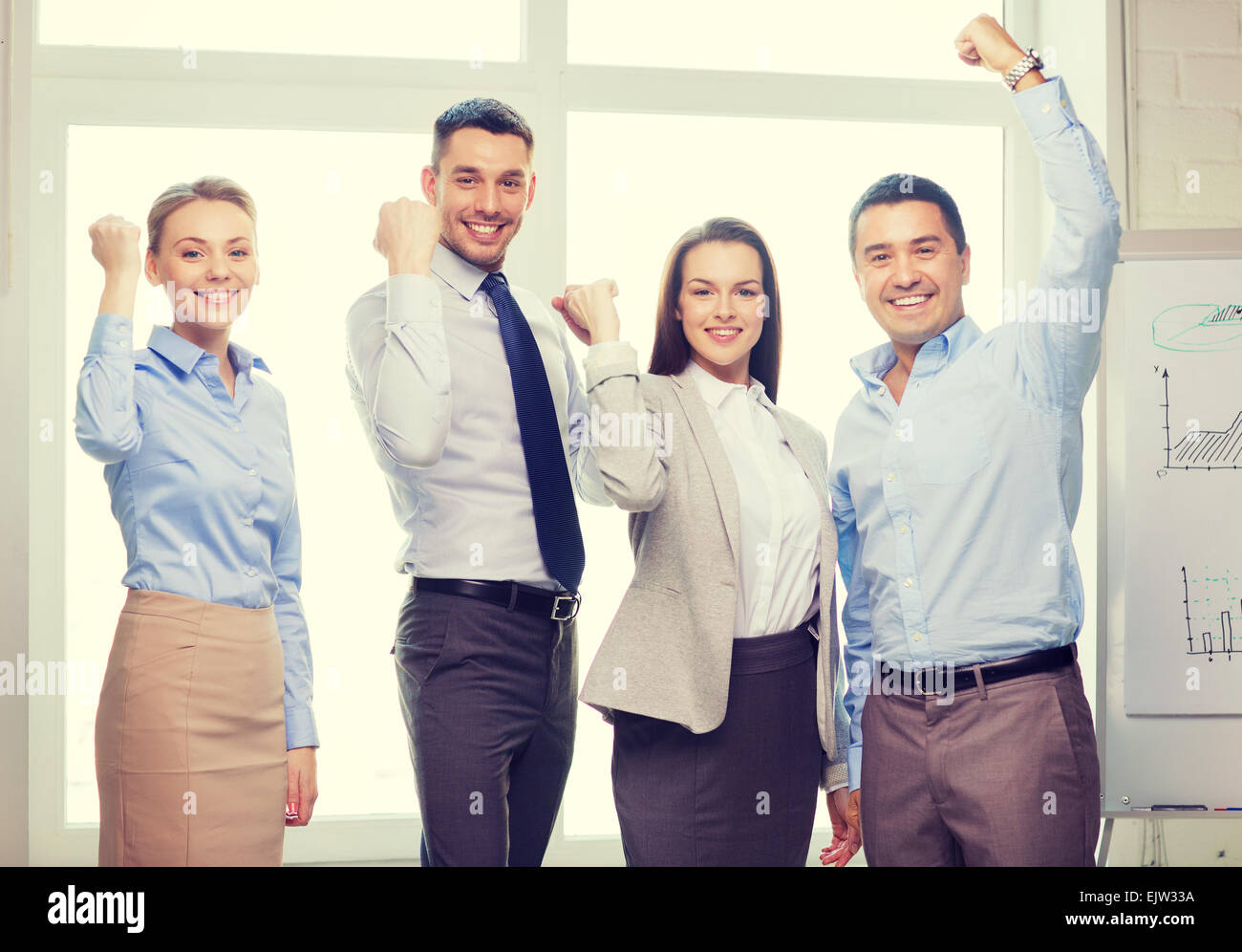 business team celebrating victory in office Stock Photo - Alamy