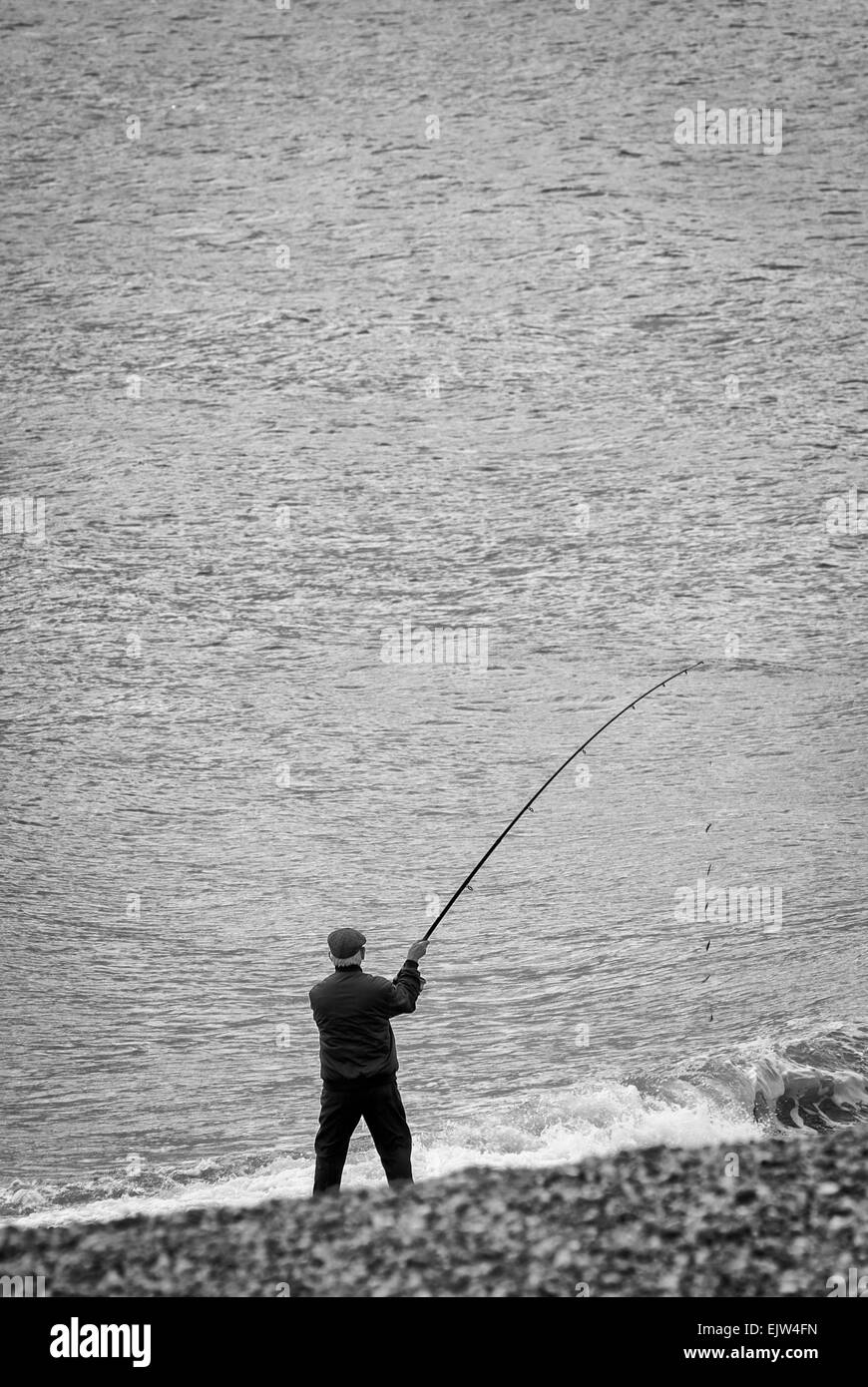 Fishing man on beach Black and White Stock Photos & Images - Alamy
