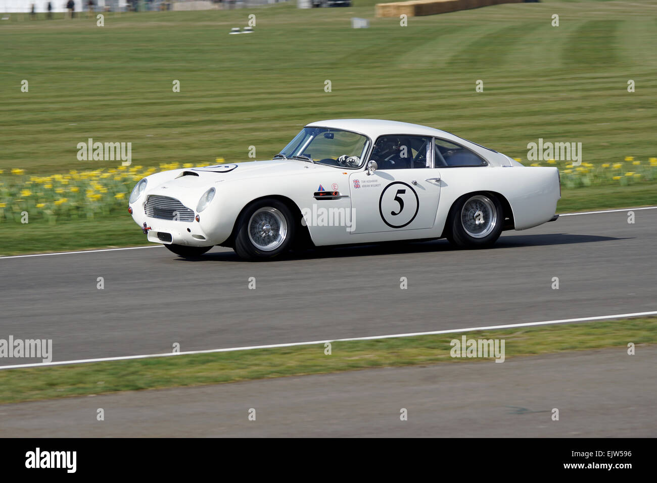 The Aston Martin DB4GT of Tom Alexander and A Willmott cornering hard ...
