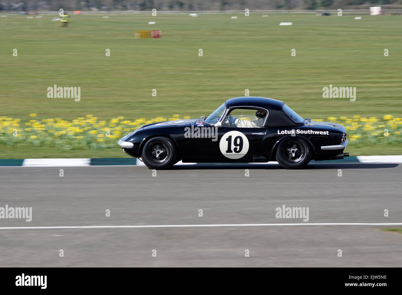 The Lotus 26R of Mark Midgley and C Woodgate cornering hard at the ...