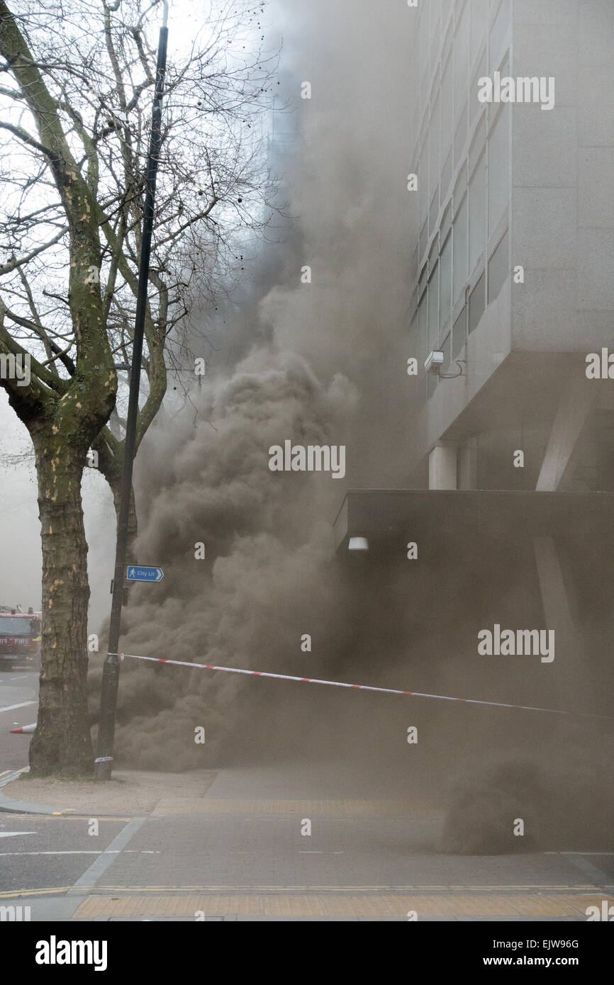London, UK. 1st April, 2015. Smoke from an electrical fire under the ...