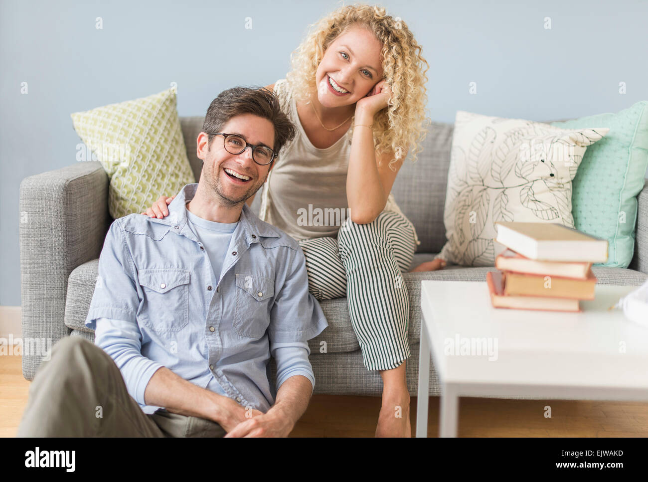 Portrait of couple in living room Stock Photo - Alamy