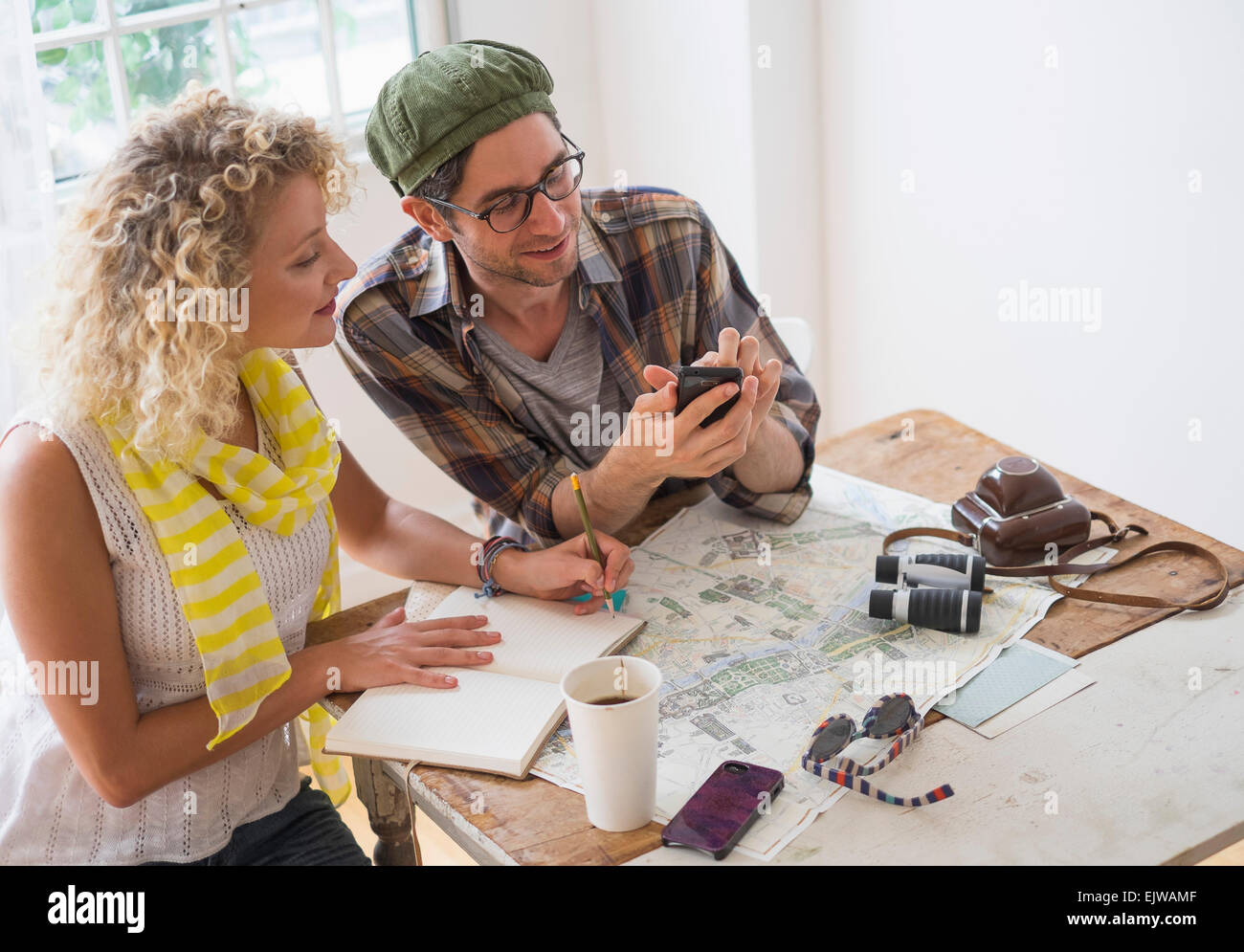 Couple making plans for travel Stock Photo - Alamy