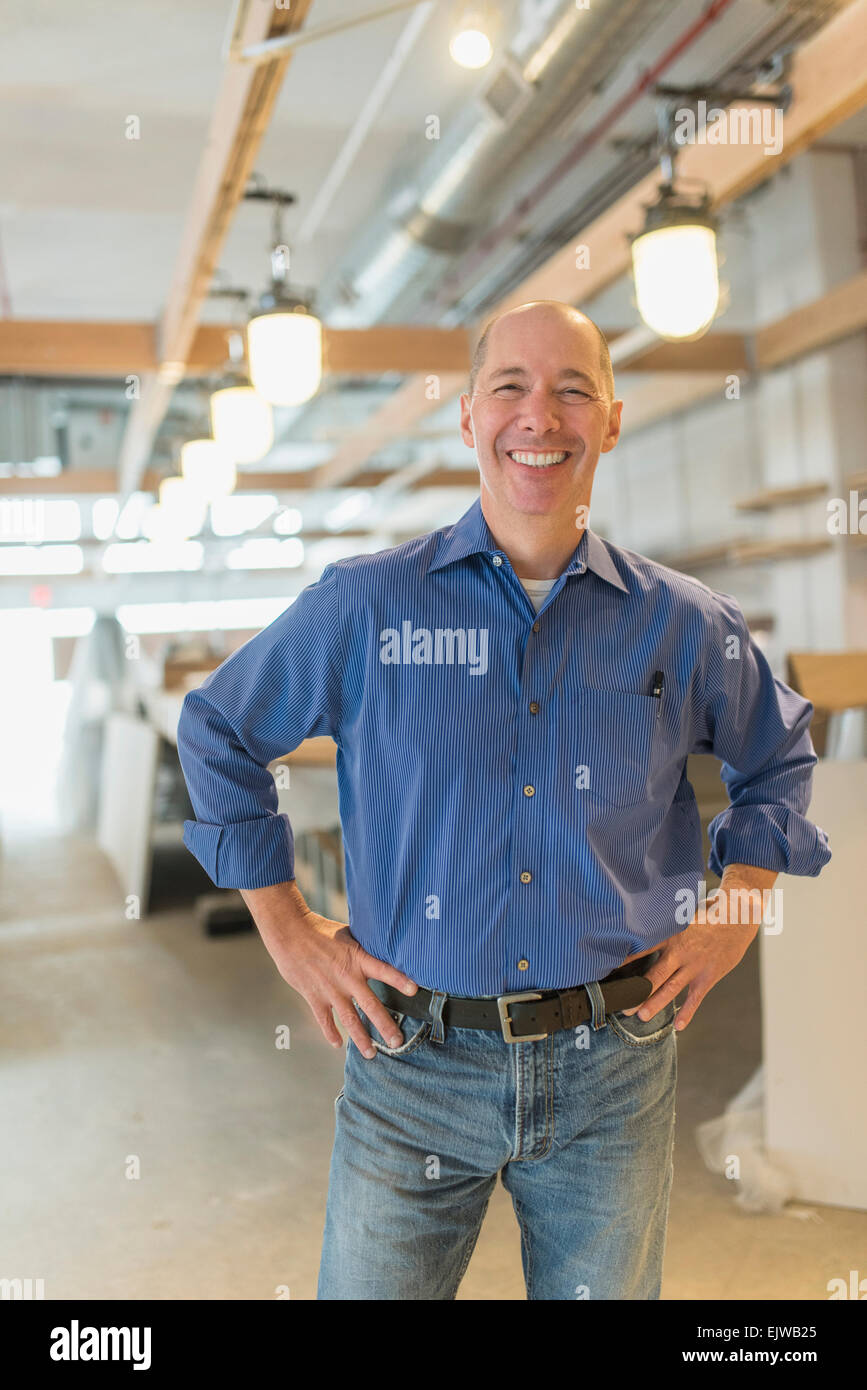 Portrait of smiling business owner Stock Photo - Alamy