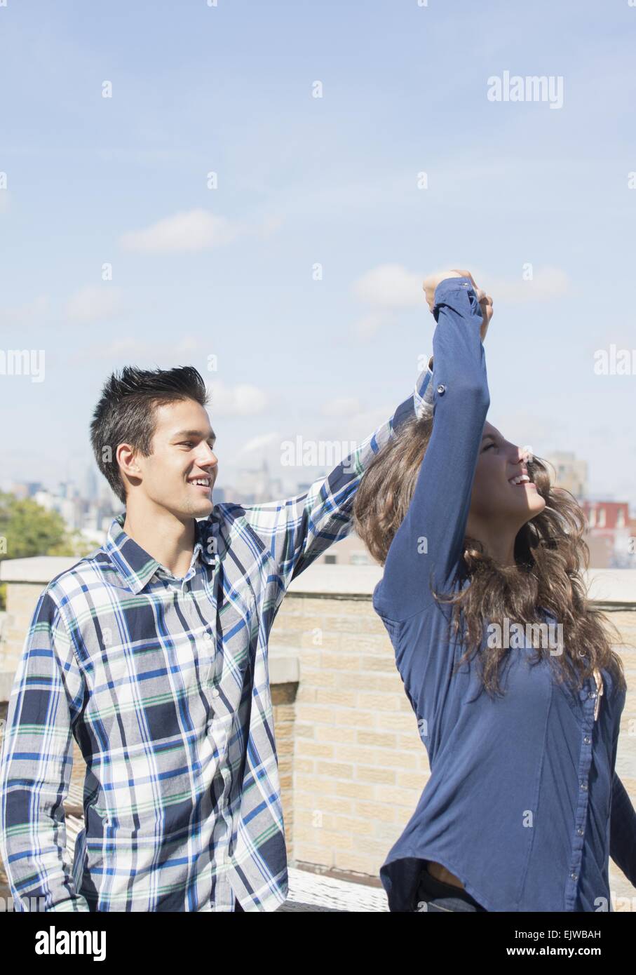 USA, New York State, New York City, Brooklyn, Young couple dancing on ...