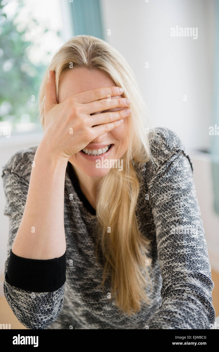Woman covering face on hi-res stock photography and images - Alamy