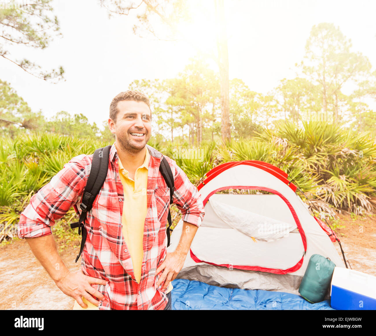 USA, Florida, Jupiter, Man with backpack in front of tent Stock Photo ...