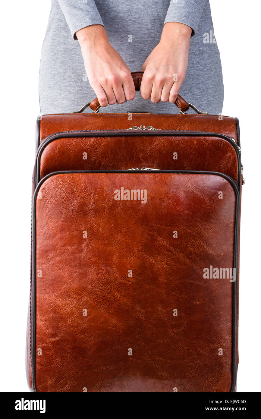 Woman holds leather suitcase Stock Photo - Alamy