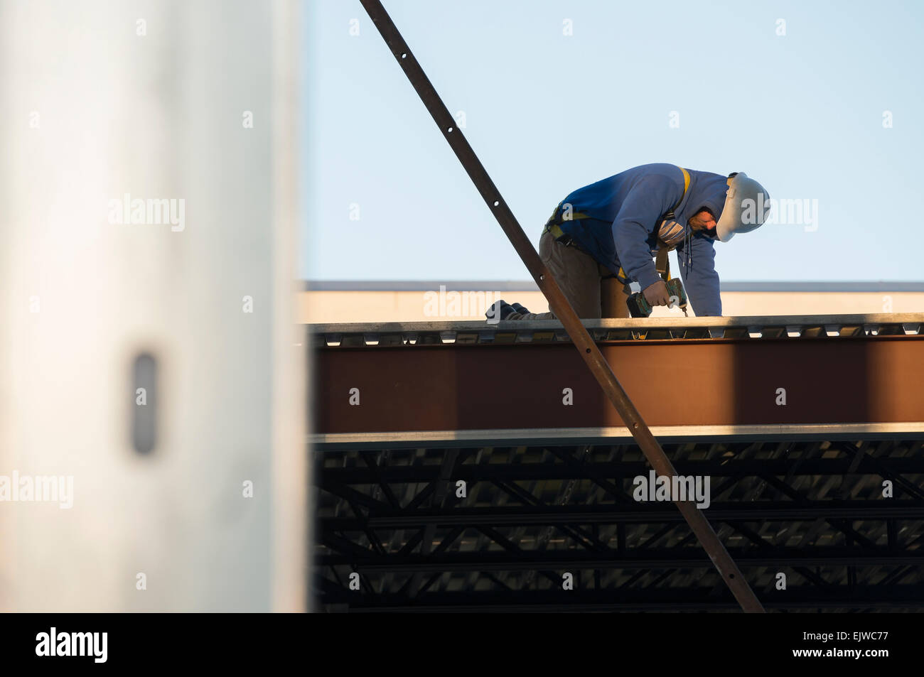 USA, Montana, Kalispell, Man working at construction site Stock Photo ...