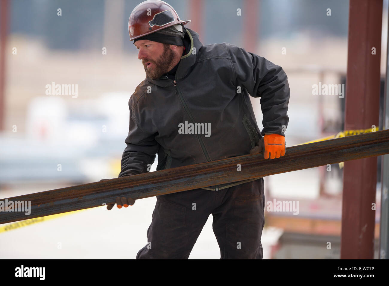 USA, Montana, Kalispell, Man lifting steel bar Stock Photo - Alamy