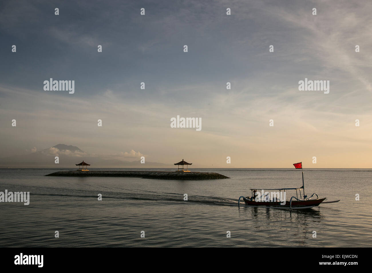 A boat sailing in the morning on Karang Beach, Sanur, Bali, Indonesia ...